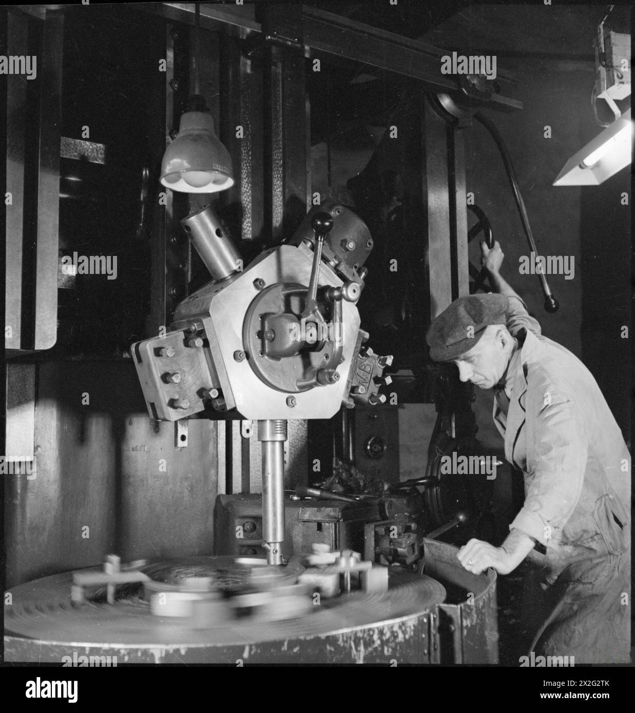 Ernest Tasker works on machinery in an underground factory at Spring ...