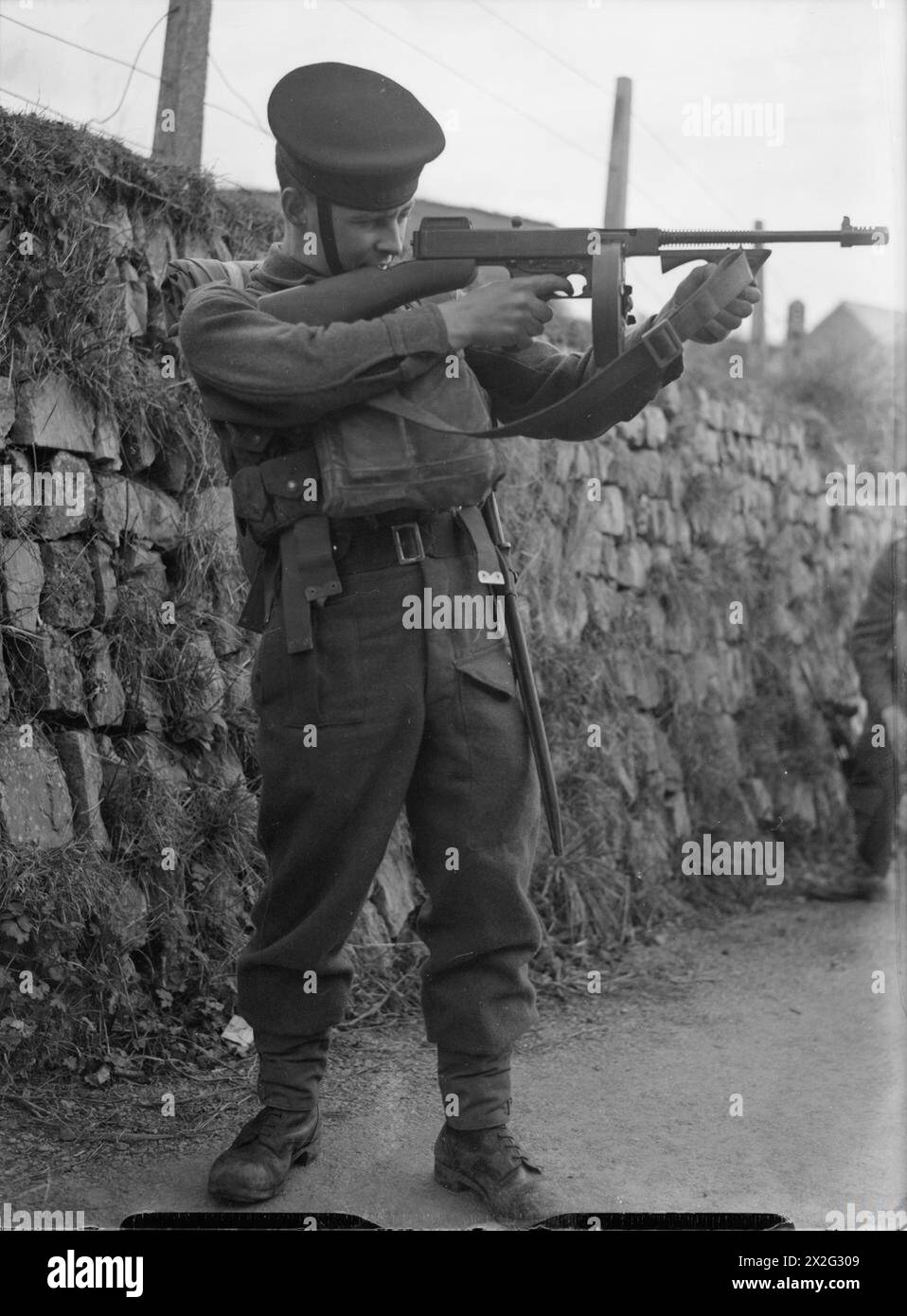 TOMMY GUNS FOR SAILORS. 1940, TOMMY GUNS BEING USED BY NAVAL UNITS WHO ...