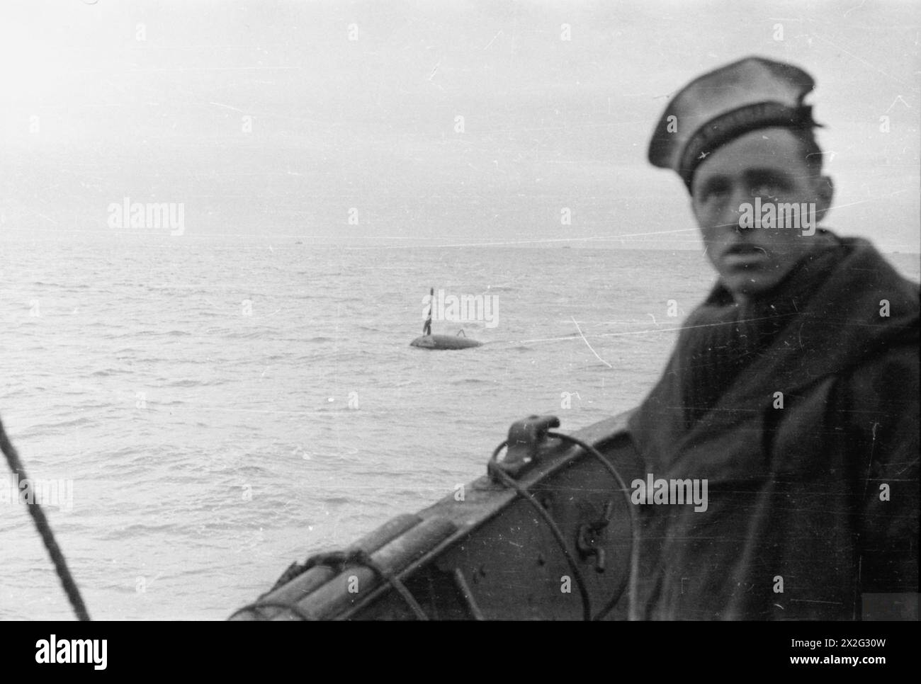 Minesweepers deploy the orepesa float at sea during operations in 1940 ...