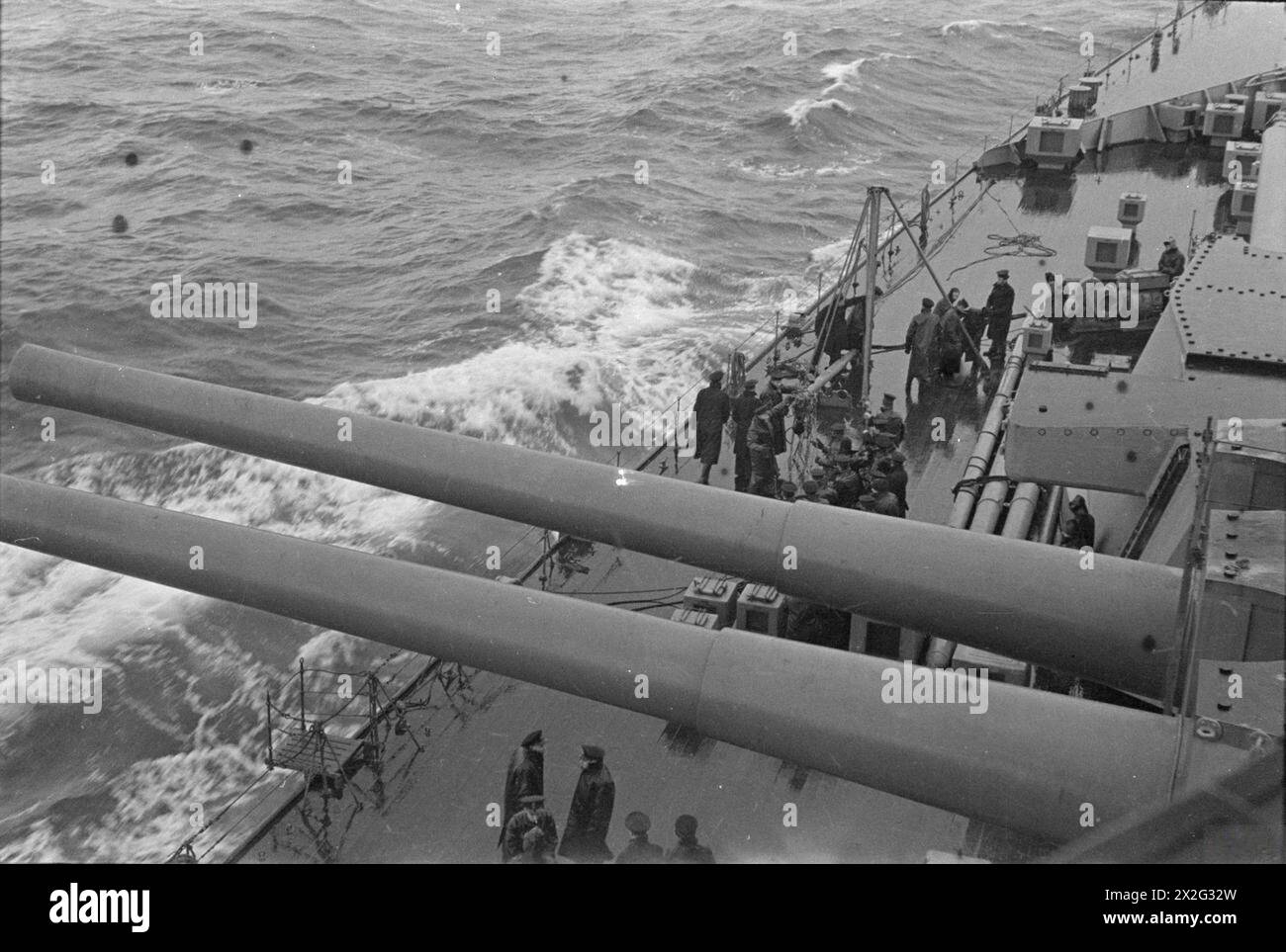 In January 1941 on board HMS King George V, crew members stow the ...