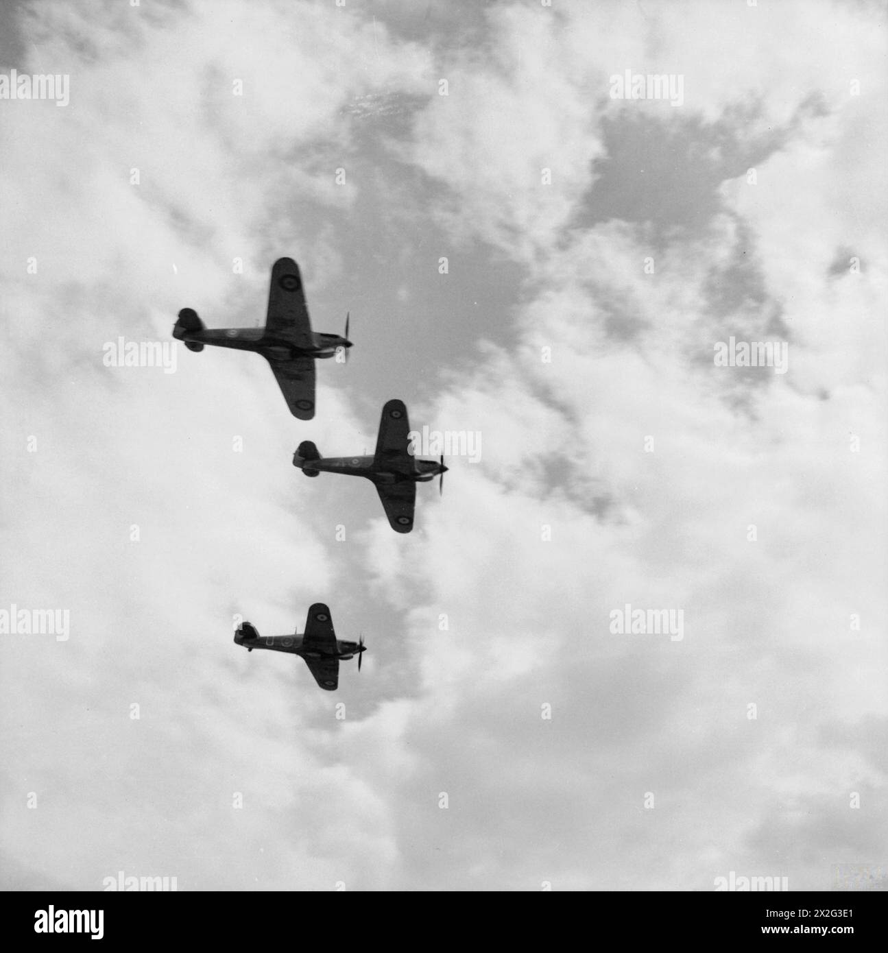 Three Hawker Hurricane Mark I aircraft of No. 3 Squadron SAAF in flight ...