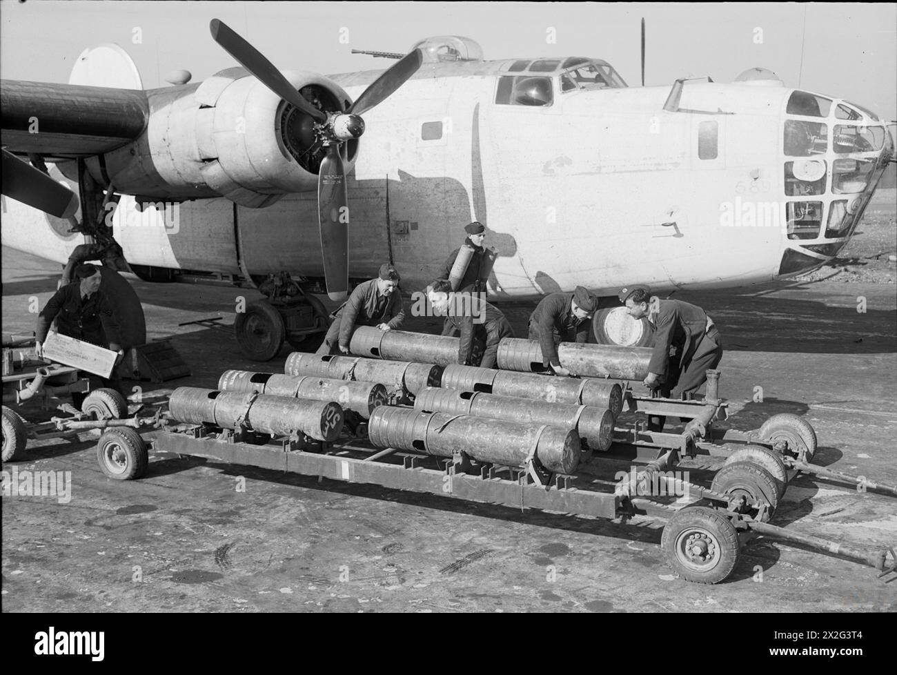 RAF Coastal Command armourers at St Eval, Cornwall, unload 250-lb Mark ...