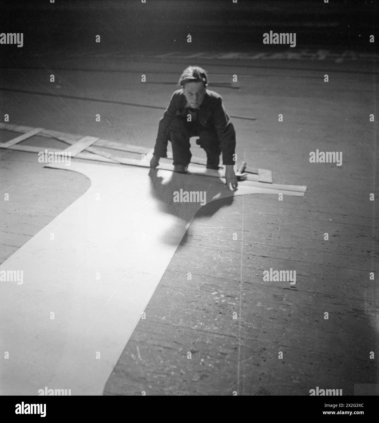 In 1943 at Tyneside shipyards, a young man creates templates in the ...