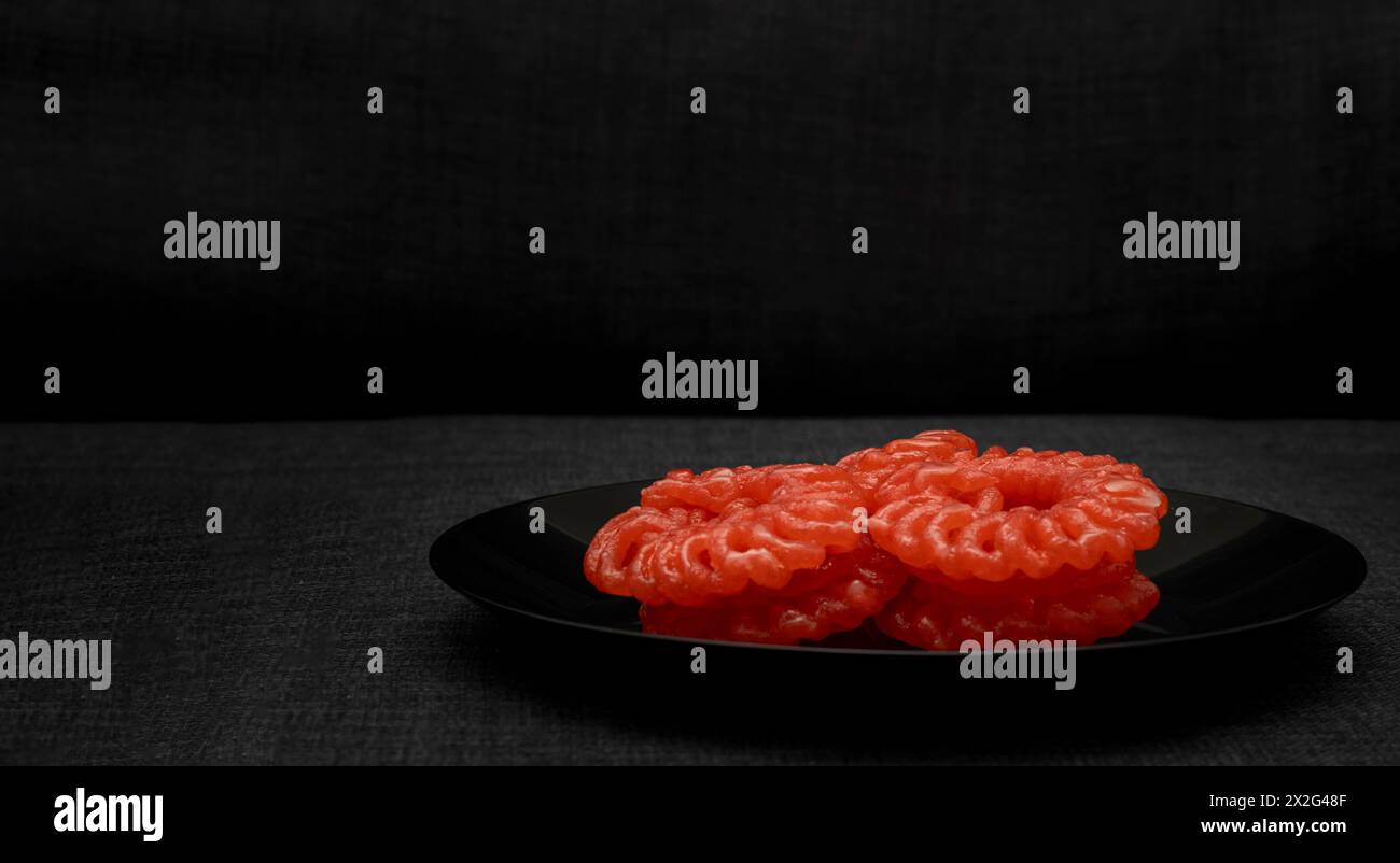 Closeup Image Of Indian Special Sweet Snack Orange Color Jalebi In Dark ...