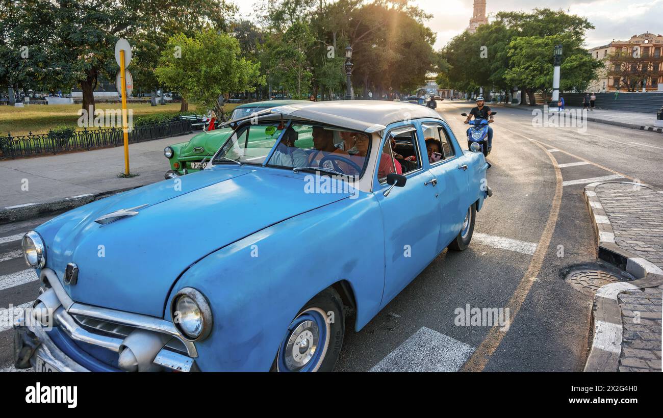 Vintage american old car driving on city street Stock Photo - Alamy