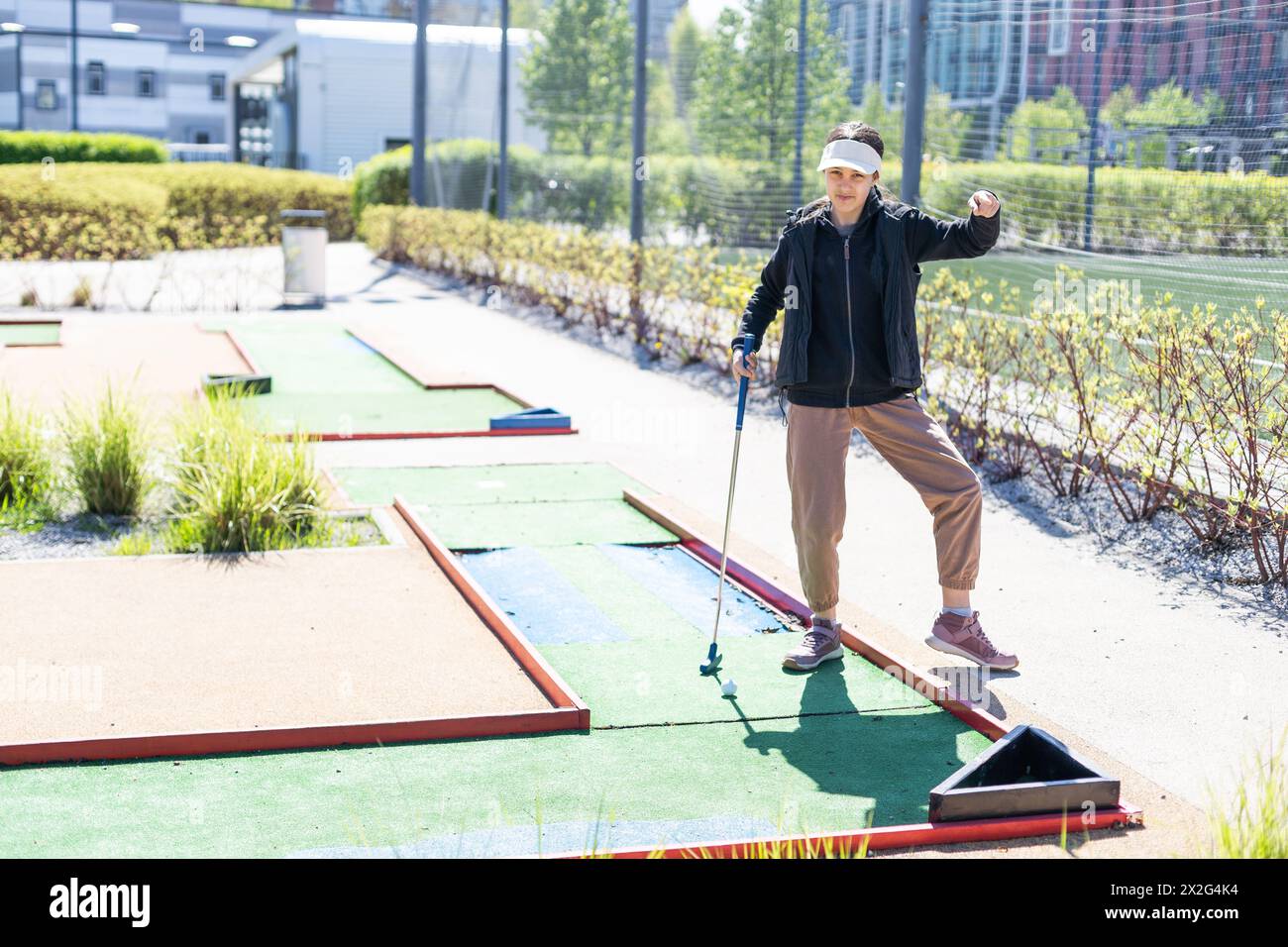 cute little girl on a miniature golf course Stock Photo - Alamy