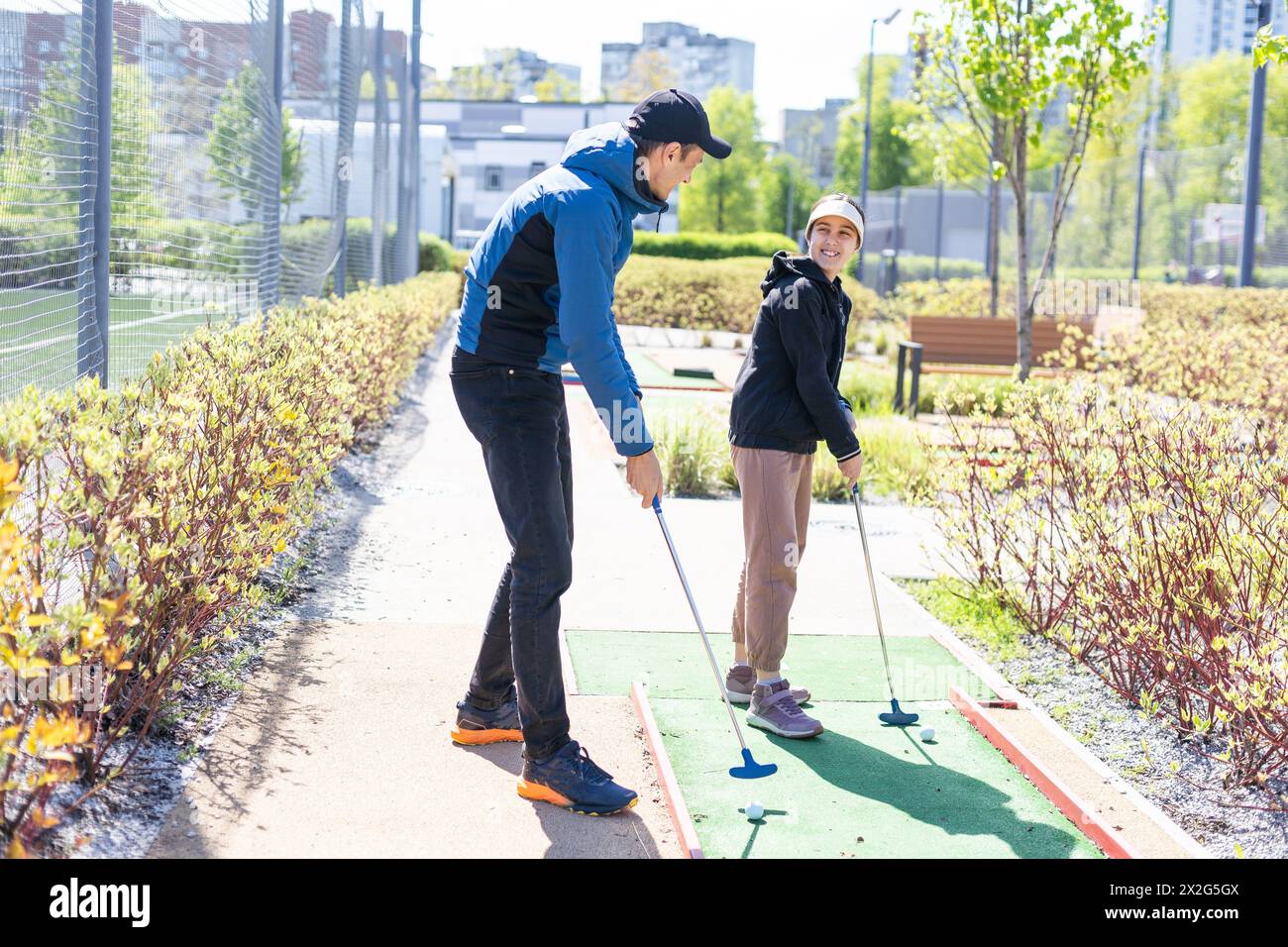 cute little girl on a miniature golf course Stock Photo - Alamy