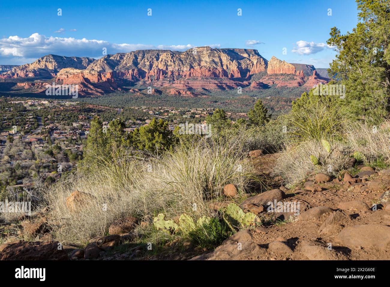 The town of Sedona, Arizona in a valley surrounded by red rock ...