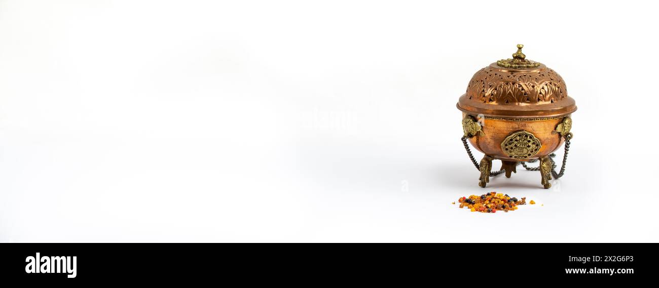 Antique portable brass incense burner and grains of incense Stock Photo ...