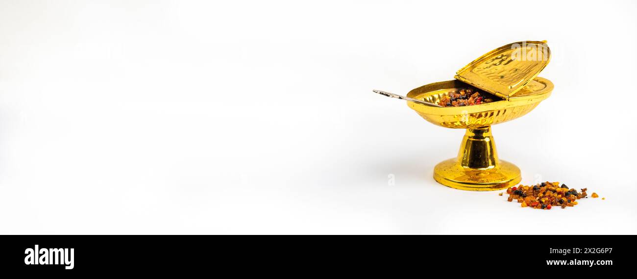 Golden incense container with open cover and grains of incense Stock ...