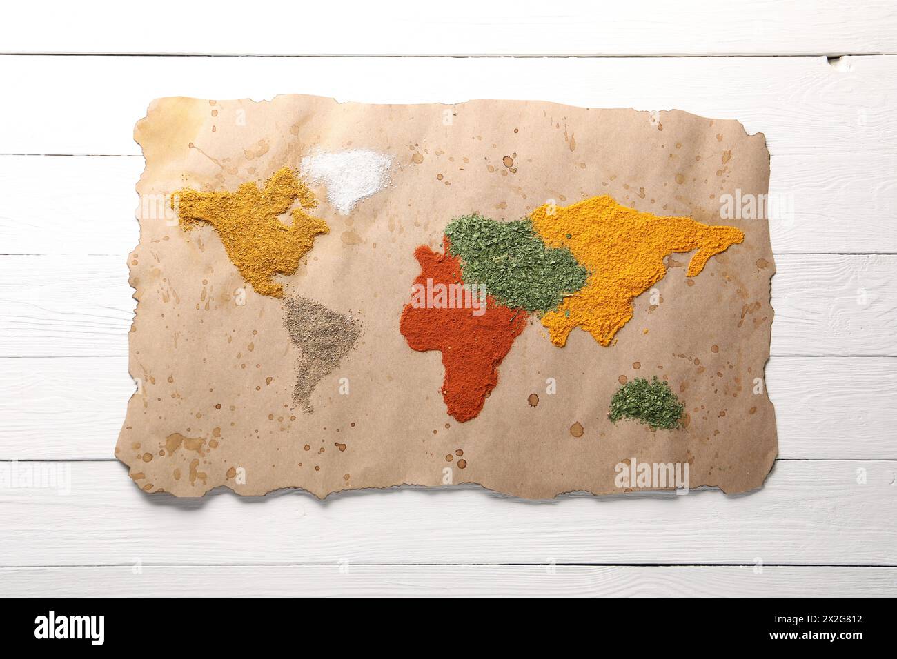 World map of different spices on white wooden table, top view Stock ...