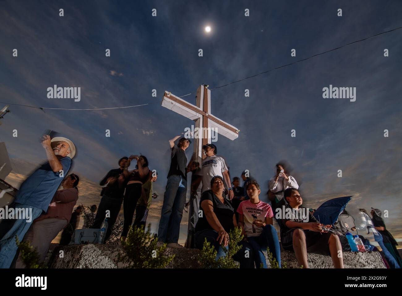 Eclipse watchers gather around cross , Nazas Mexico Stock Photo - Alamy