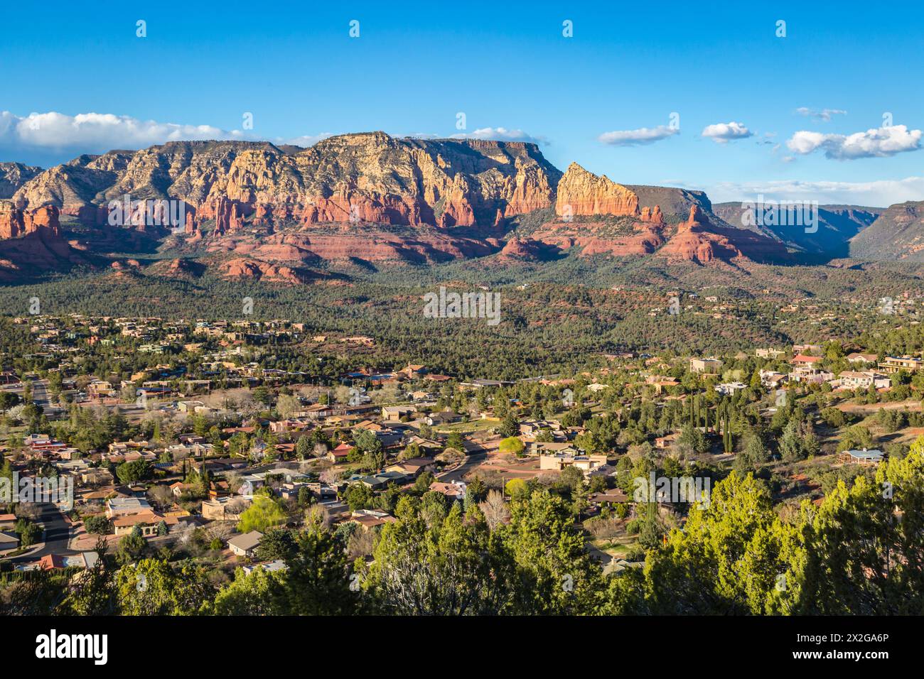 The town of Sedona, Arizona in a valley surrounded by red rock ...