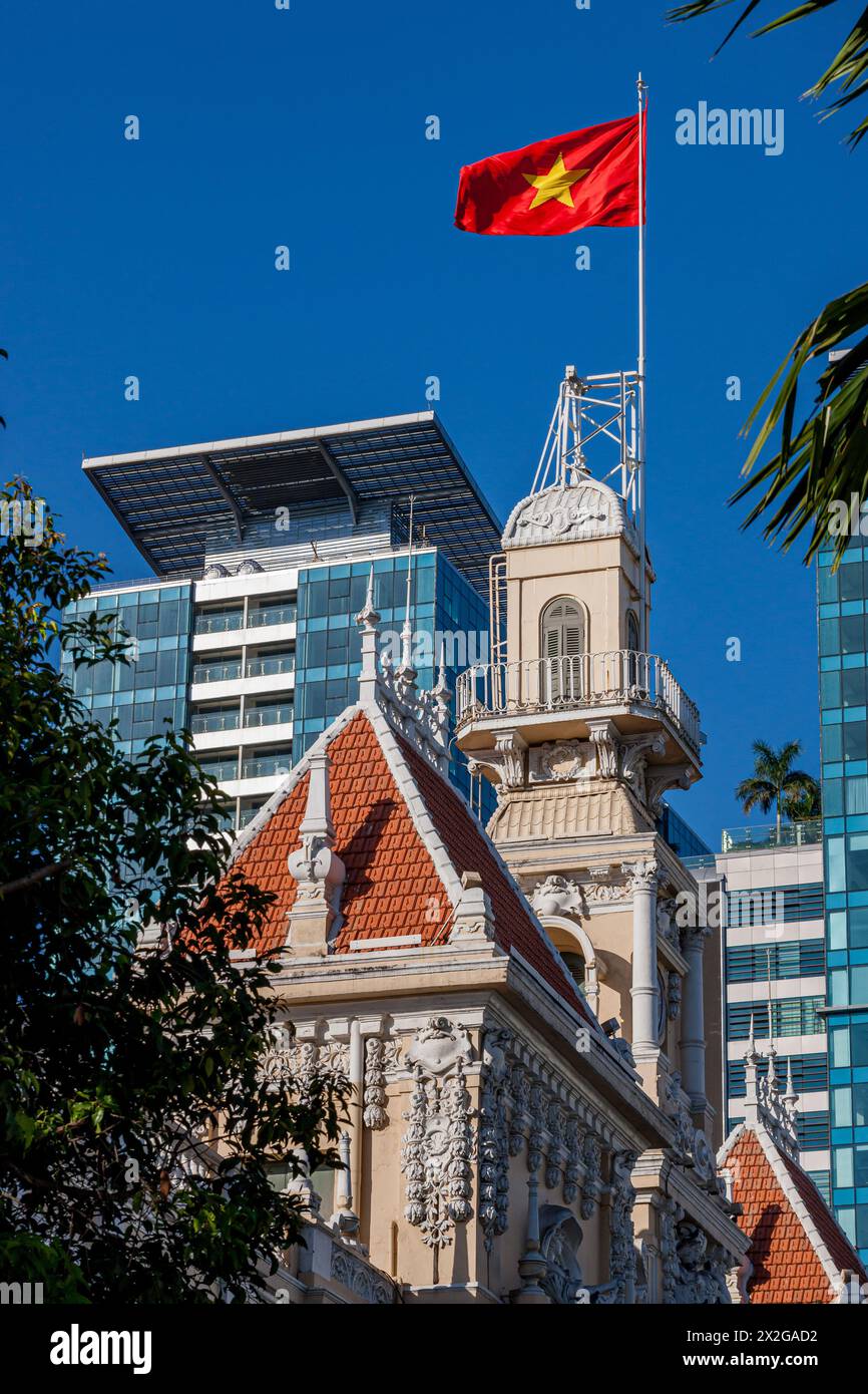 Vietnam, Ho Chi Minh City, Saigon, Buildings and Flag Stock Photo - Alamy