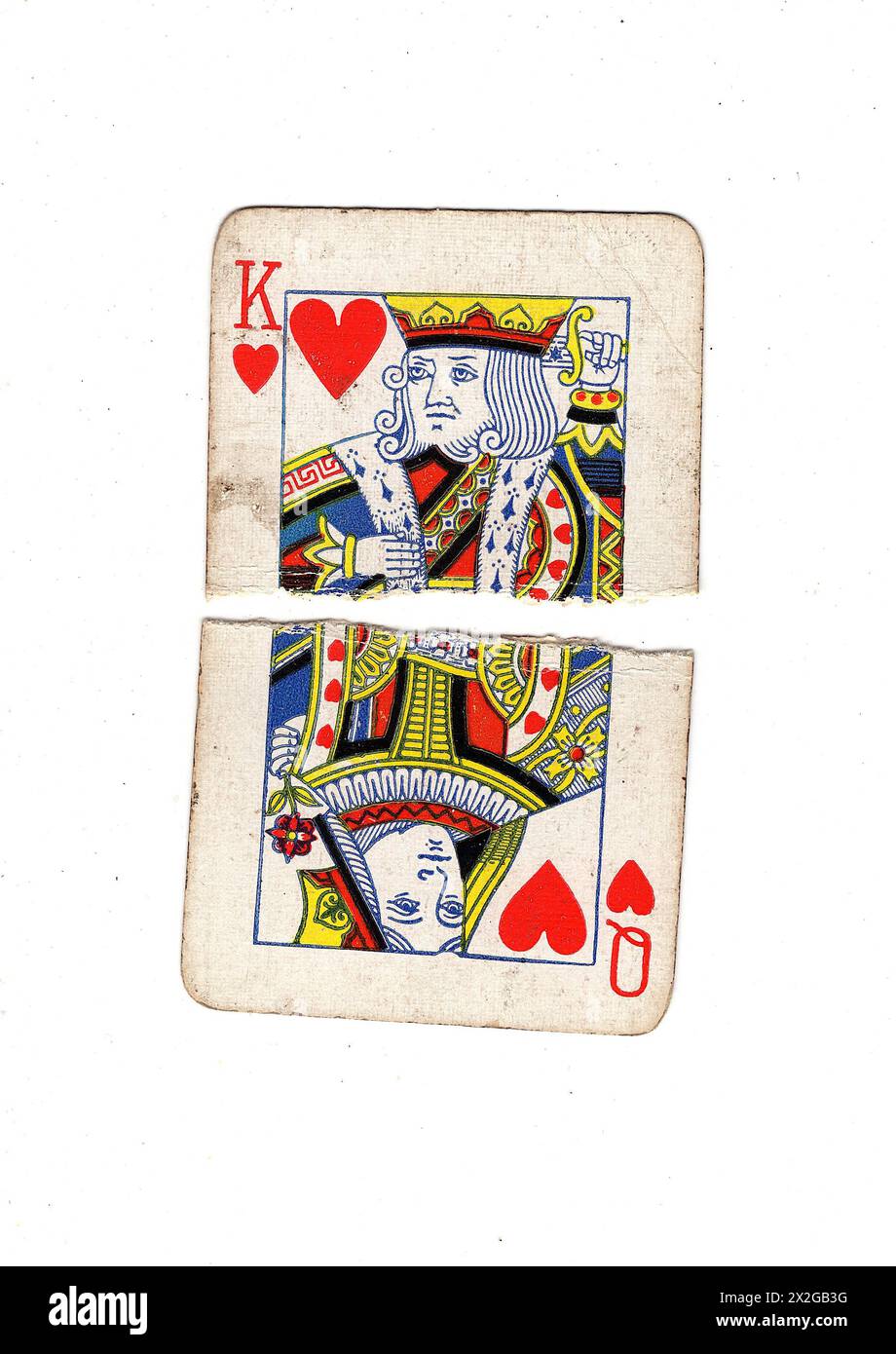 Torn halves of vintage playing cards showing a king and queen of hearts ...