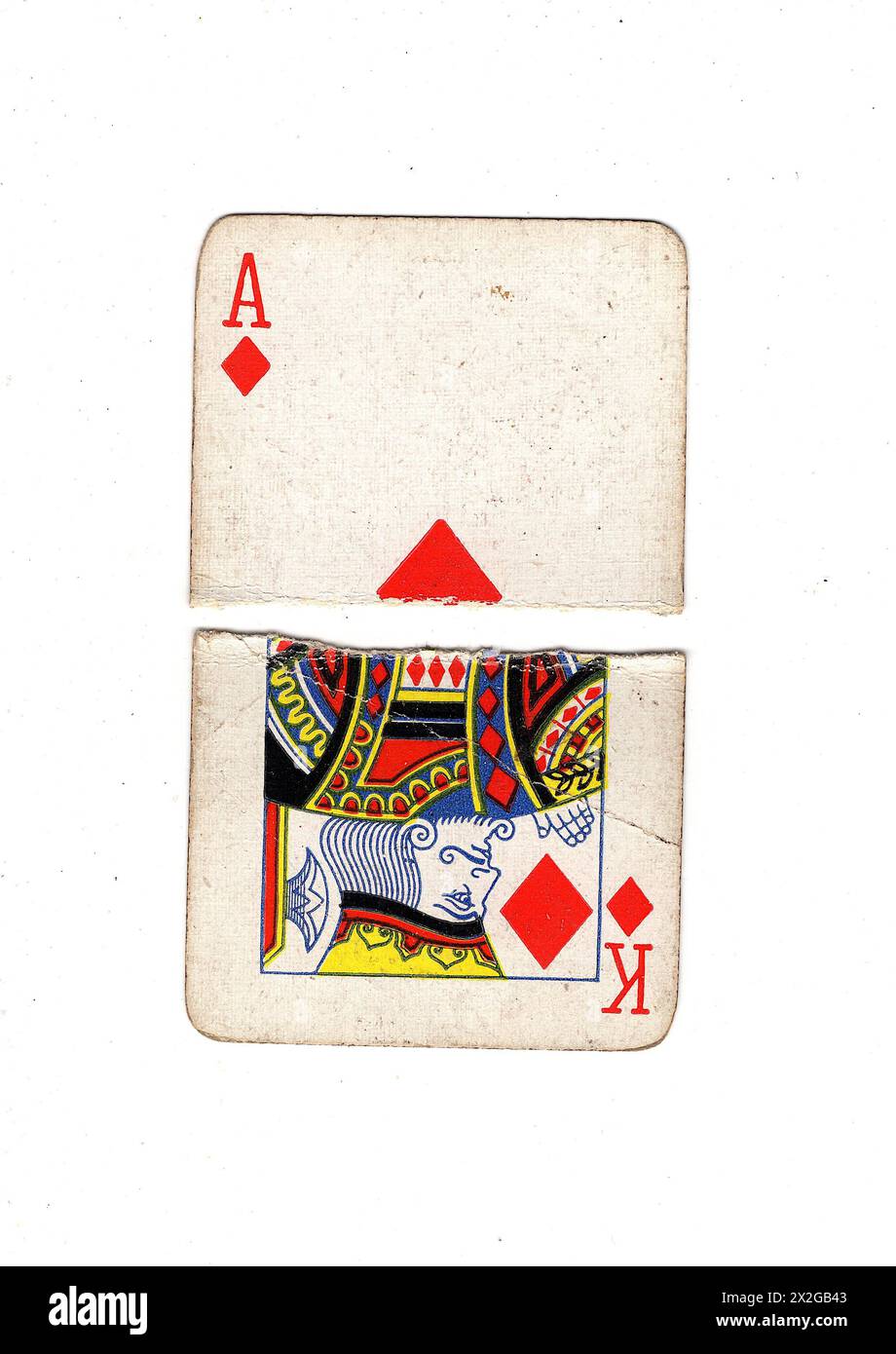 Torn halves of vintage playing cards showing an ace and king of ...