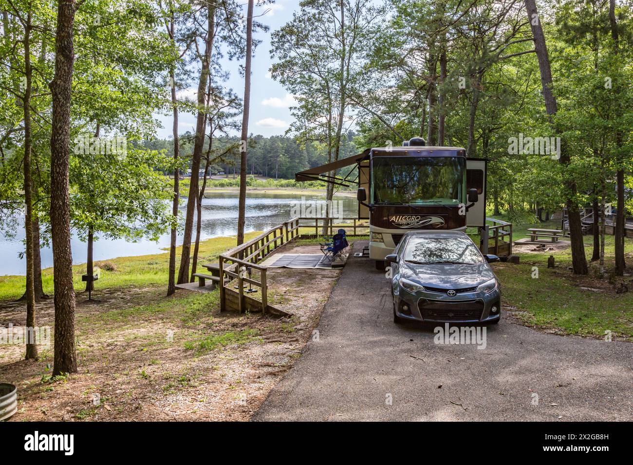 Motorhome parked in a campsite on the bank of the lake at Little Black ...