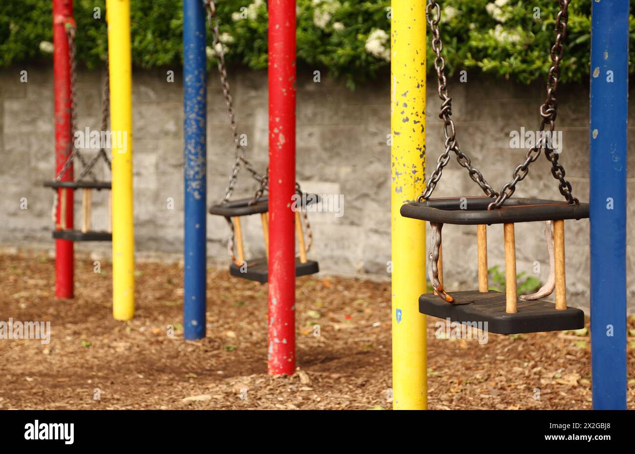 three empty teeter with chains, red, yellow, red, horizontal Stock ...