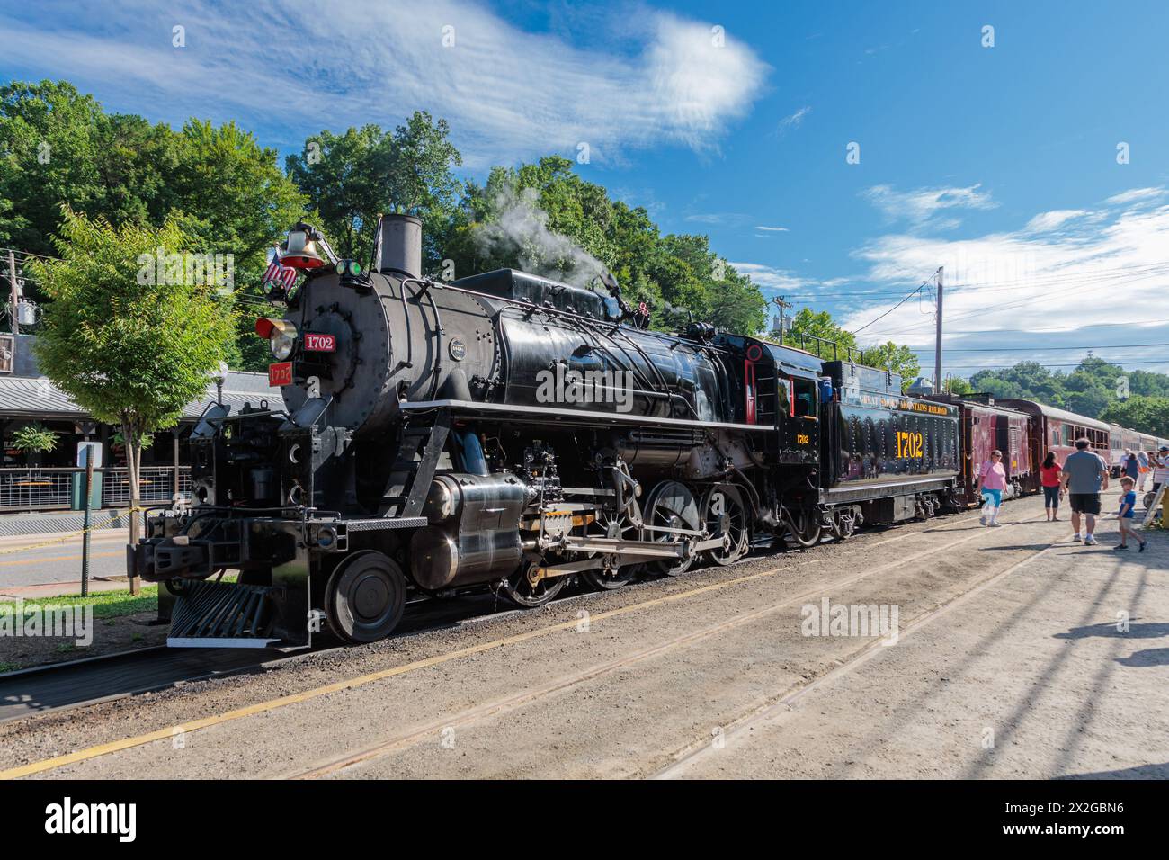 Passengers boarding the Great Smoky Mountains Railroad train pulled by ...