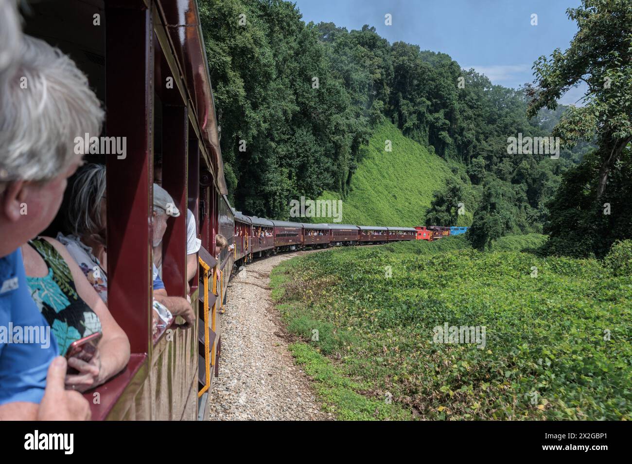 Great Smoky Mountains Railroad passengers looking out the windows of ...