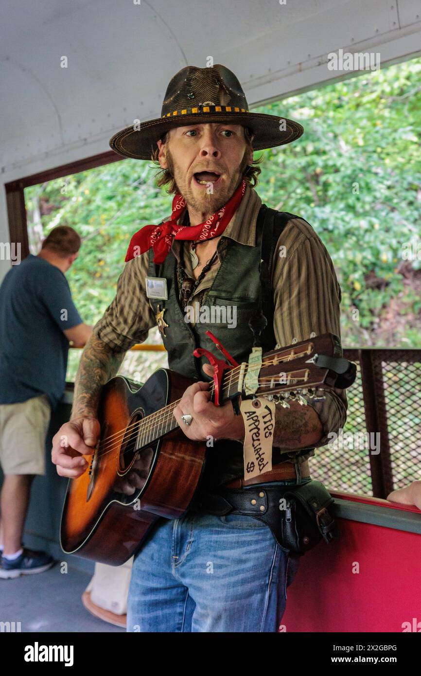 Singer and entertainer travels from car to car singing songs to the ...