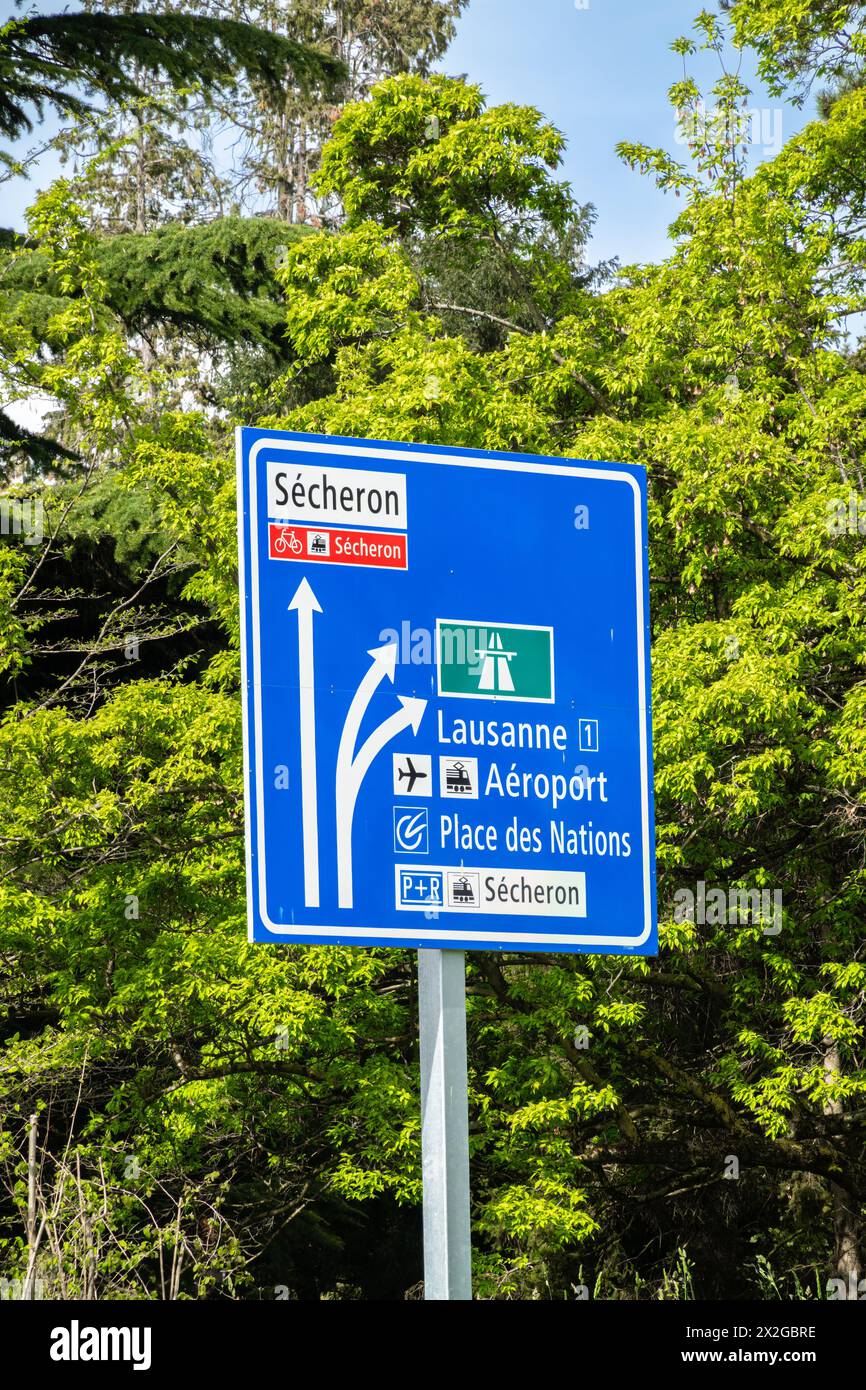 A blue traffic sign in Geneva indicating the direction of the motorway ...
