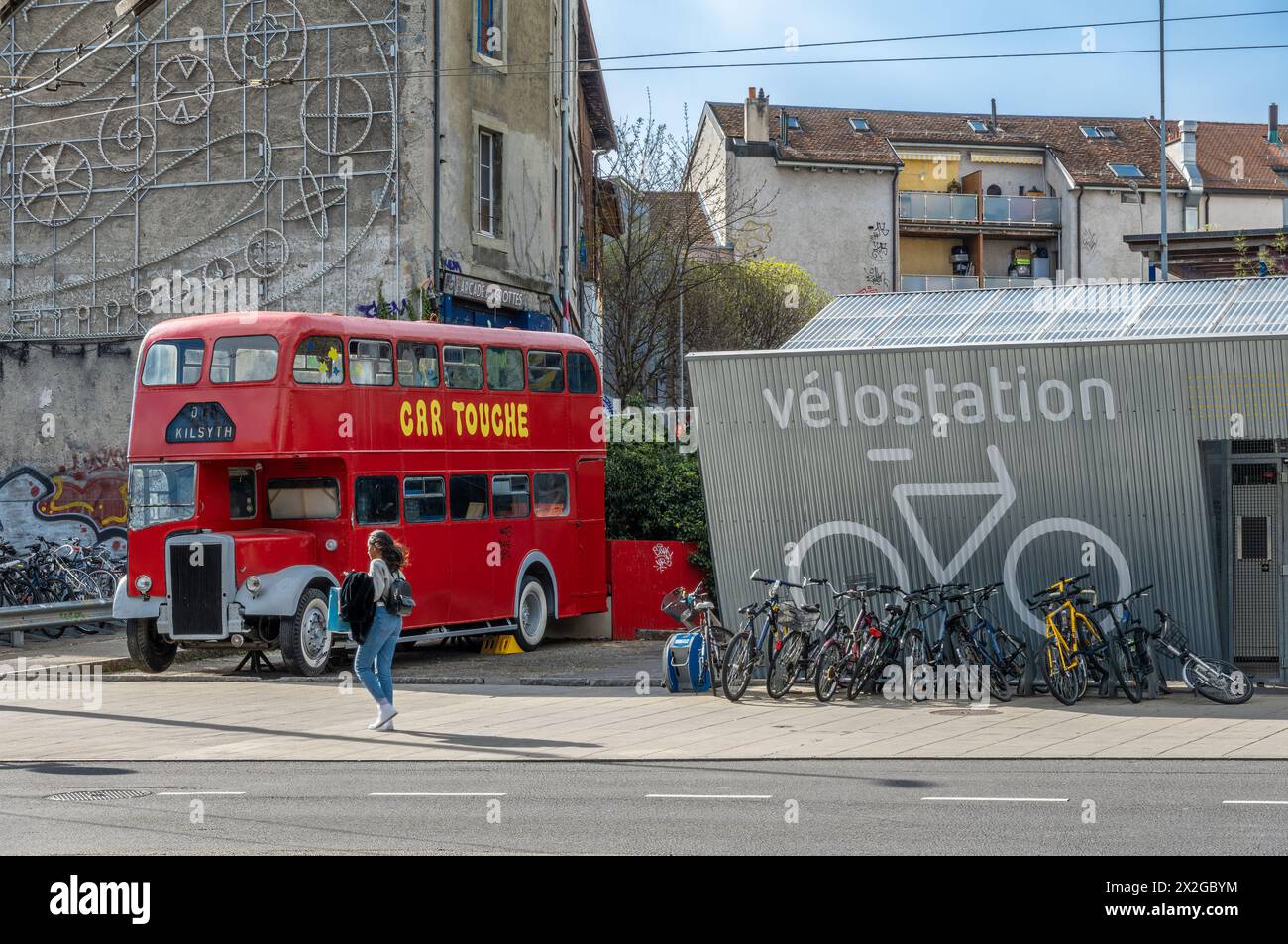 Geneva, Switzerland - April 5, 2024: Old red English double decker bus and bike repair service ...