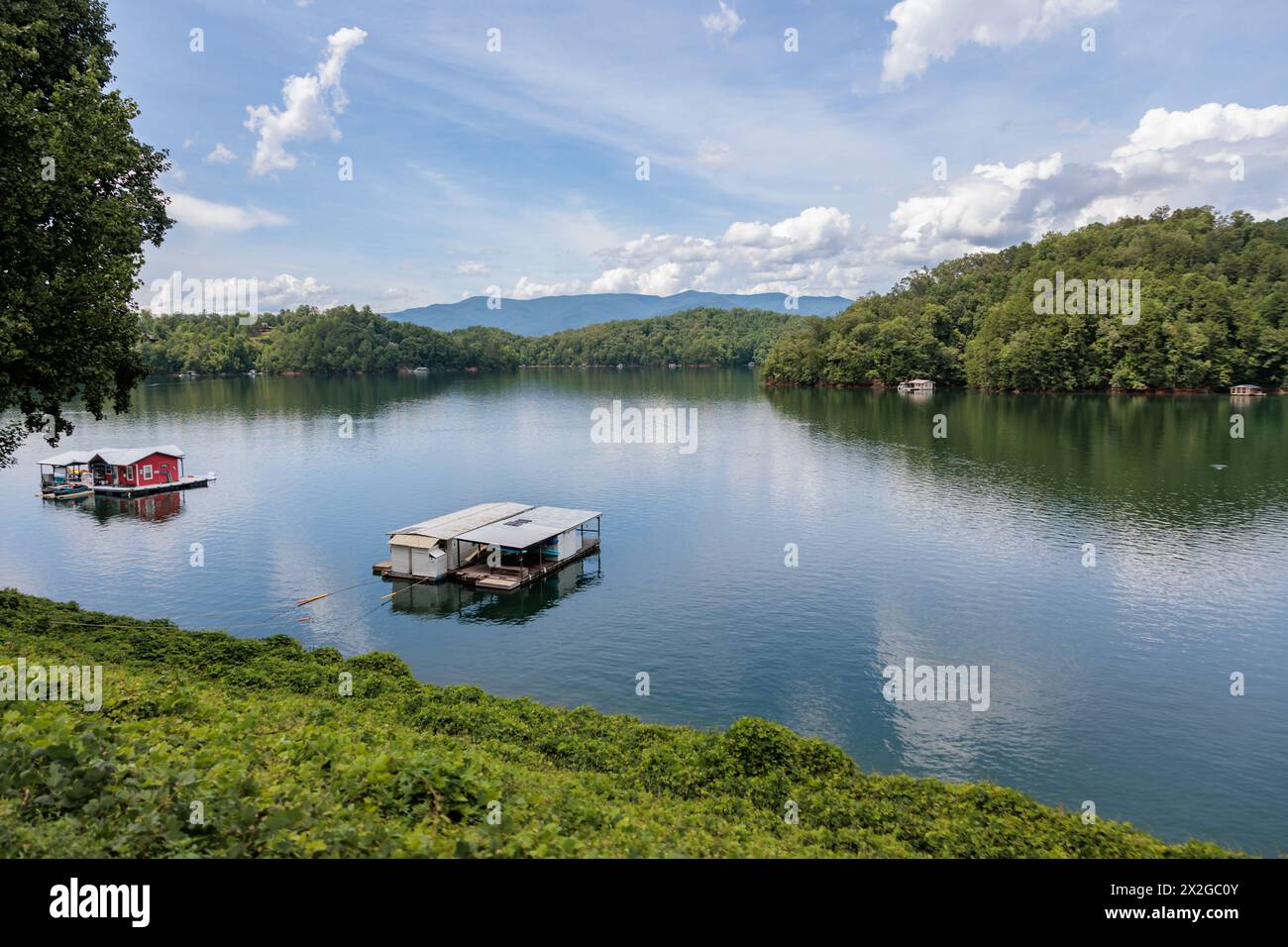 View of a house boats on Fontana Lake as seen from the open air car of ...