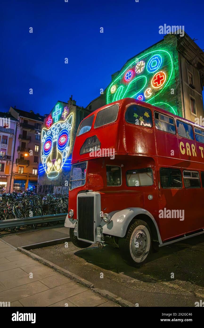 Geneva, Switzerland - April 5, 2024: Old red English double decker bus ...