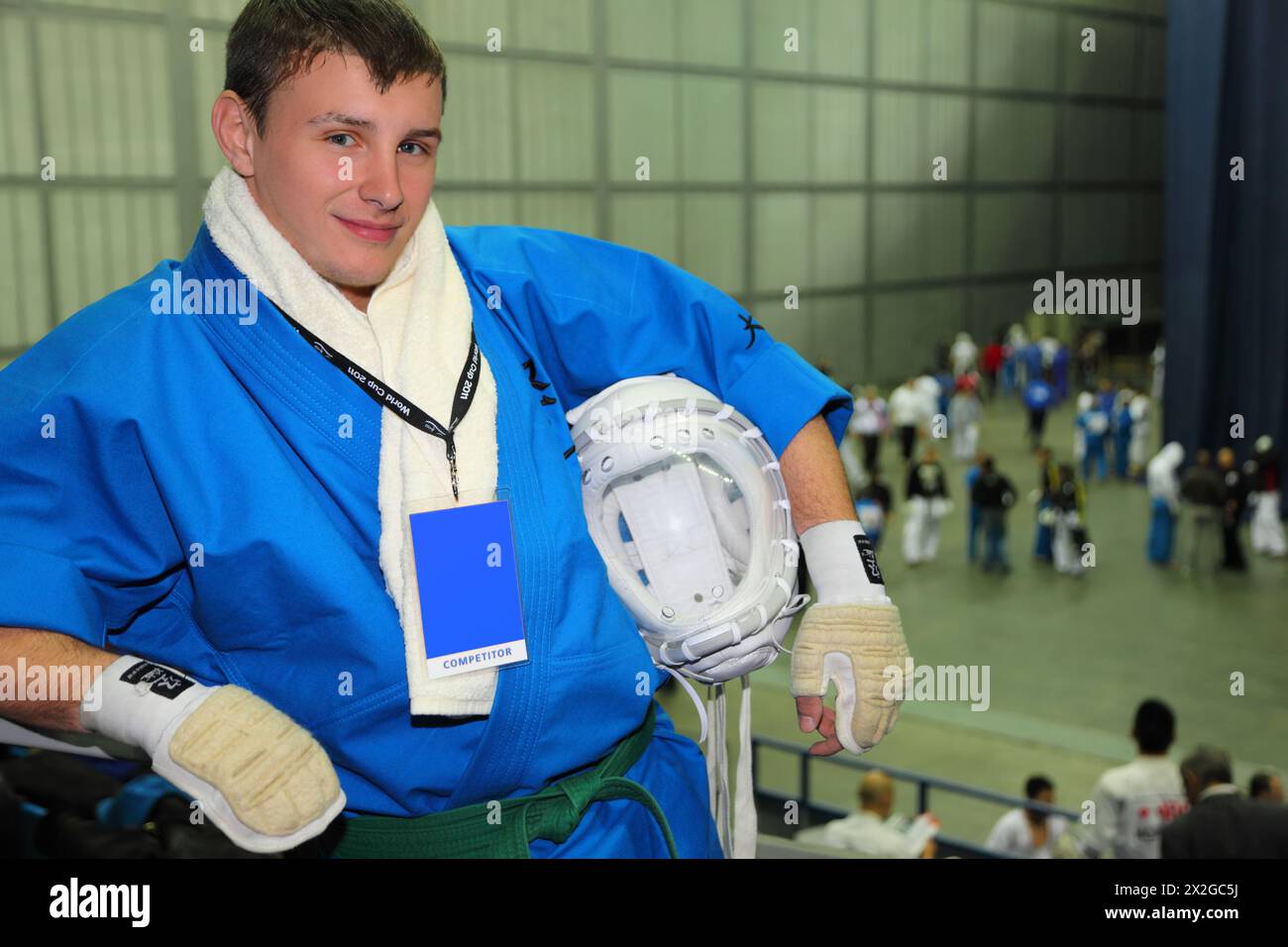 Competitor KUDO stands in hall Stock Photo - Alamy