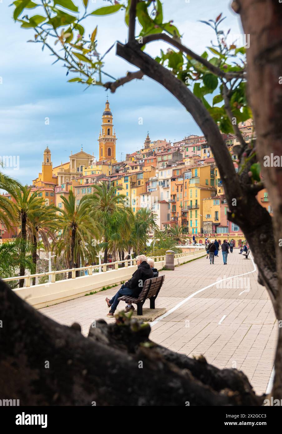 Menton, France - April 9, 2024: Old people sitting on the bench ...