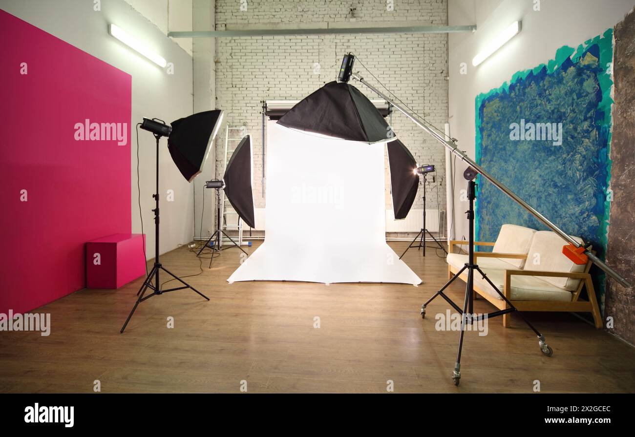 Multiple backgrounds inside studio - light room with lamps and ...