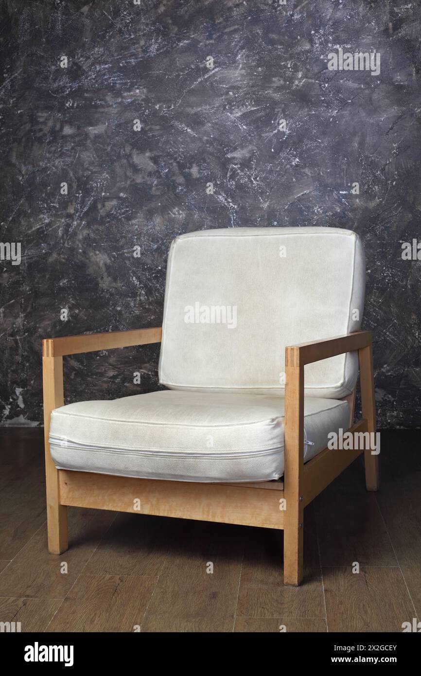 white chair in studio of photographer, brown background, side view ...