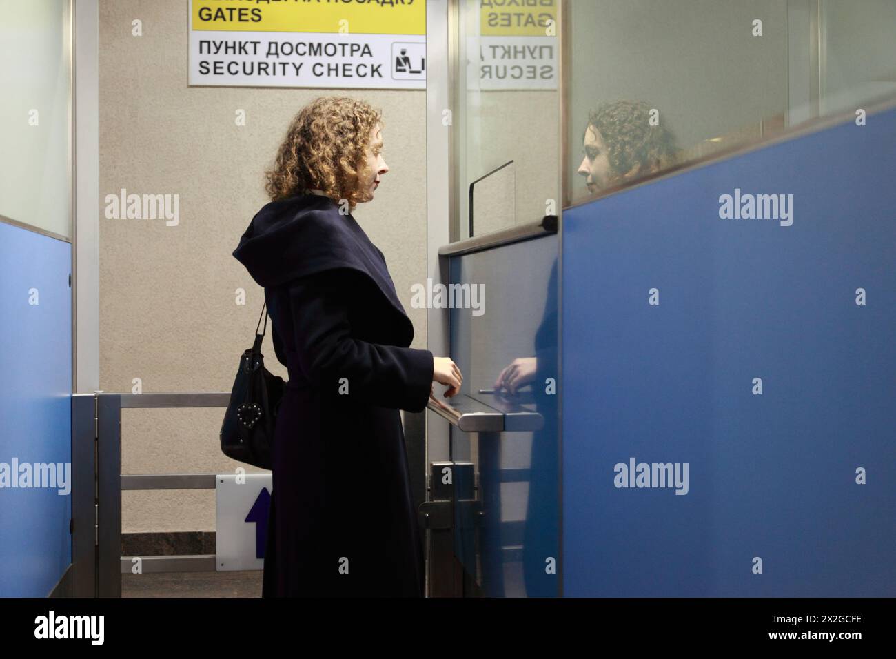 Young woman stands in the security checkpoint at the airport Stock ...