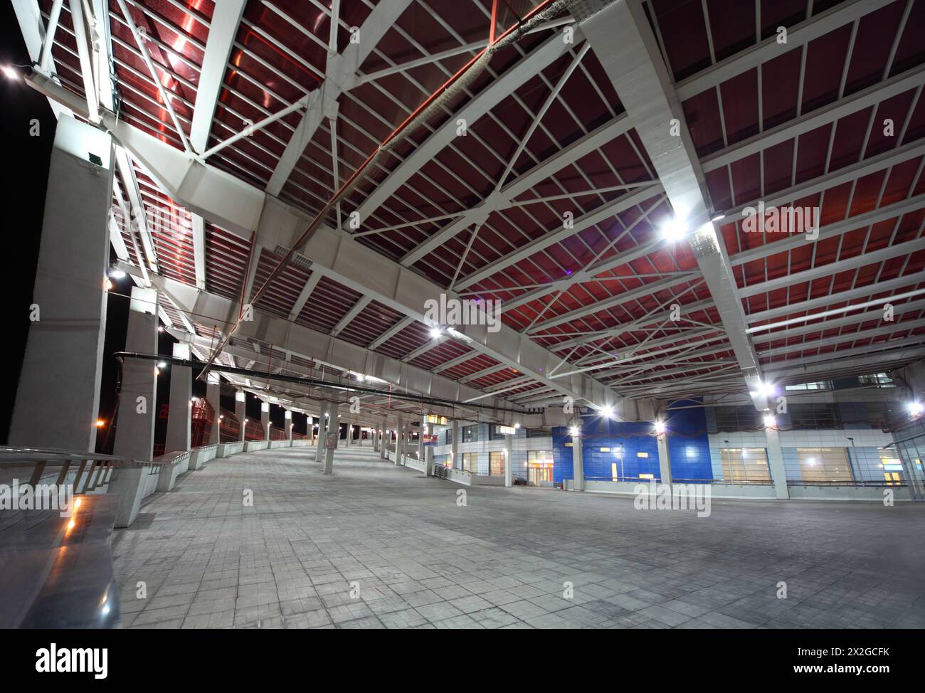 modern building, stadium, sports building at night, red ceiling, lights ...