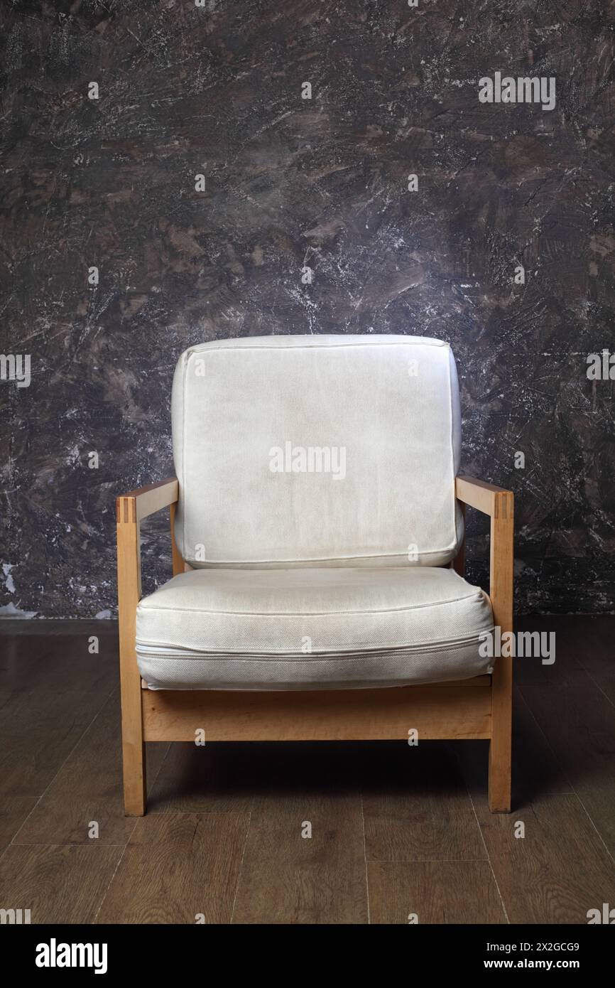 white chair in studio of photographer, brown background, front view ...