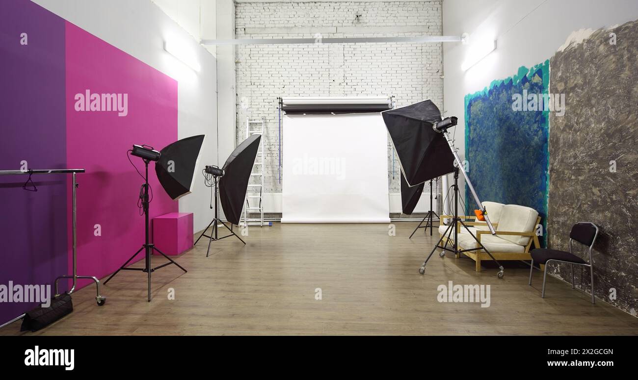 White background inside studio - light room with lamps and spotlights ...