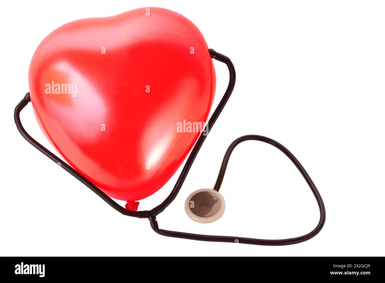 Medical stethoscope and red balloon heart isolated on white background ...