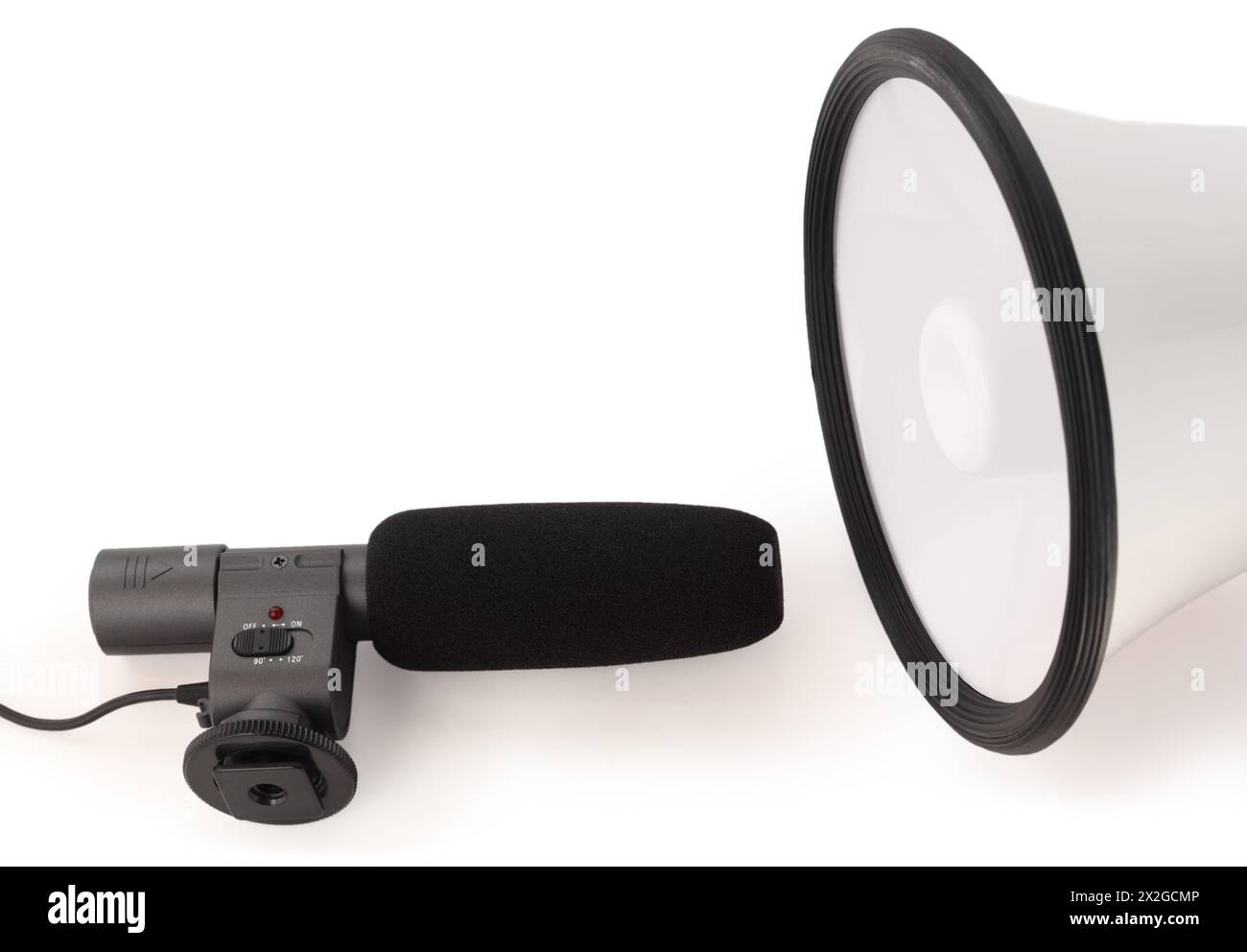 Handheld megaphone and big black microphone on white background Stock Photo - Alamy