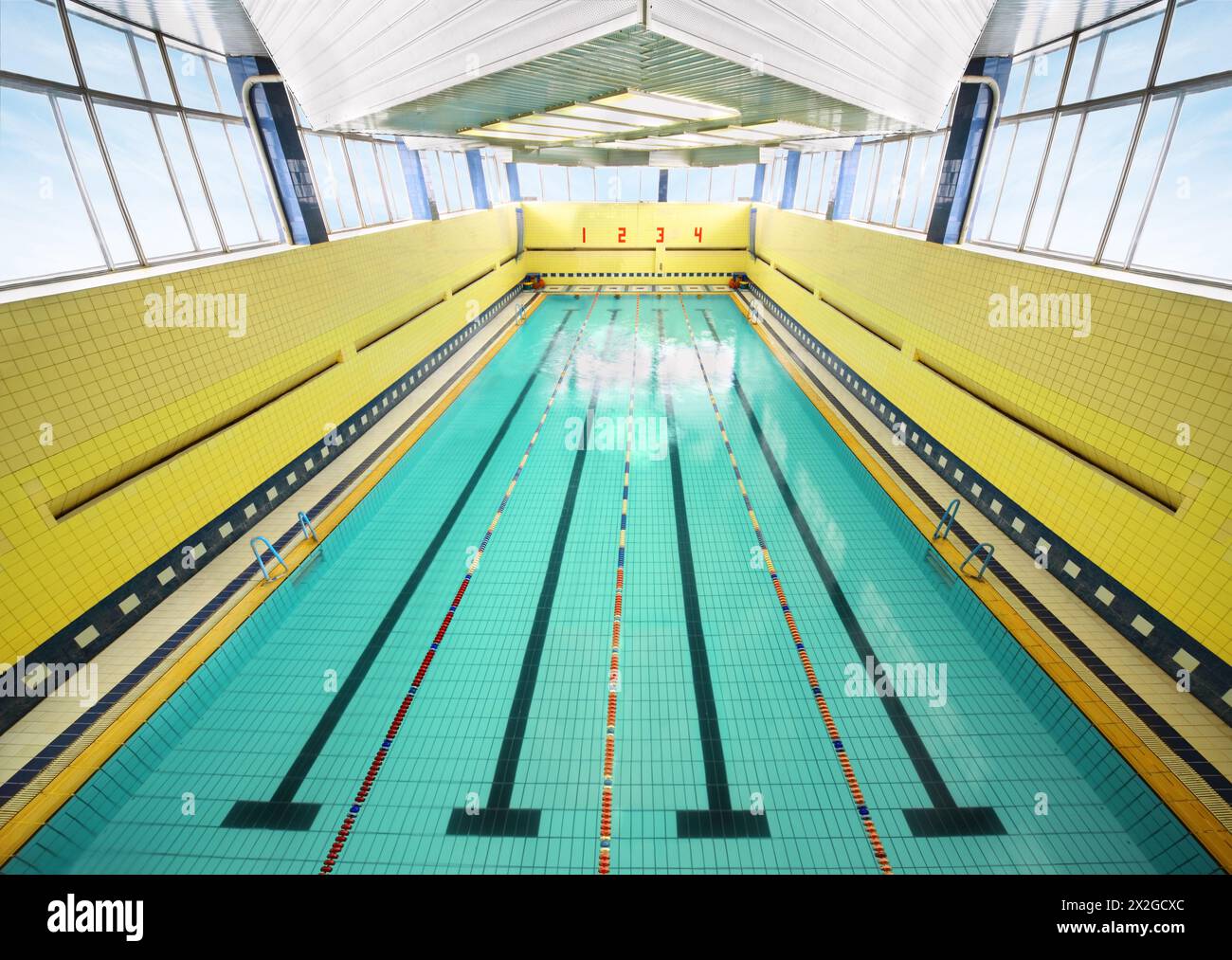 large indoor swimming pool, four bowling lanes, yellow walls, tile ...