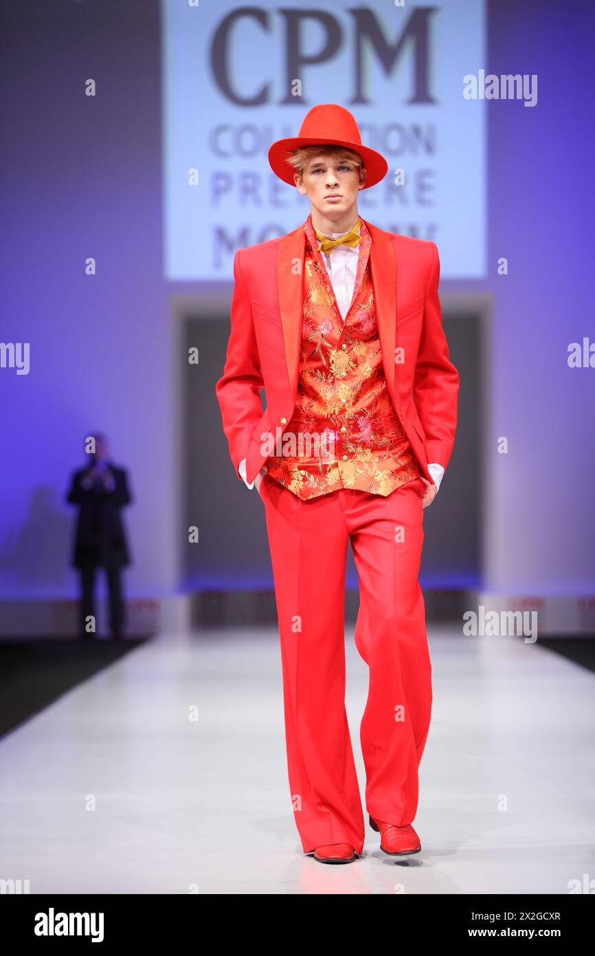 MOSCOW - FEBRUARY 22: Man wear red suit from Slava Zaytzev walk the ...