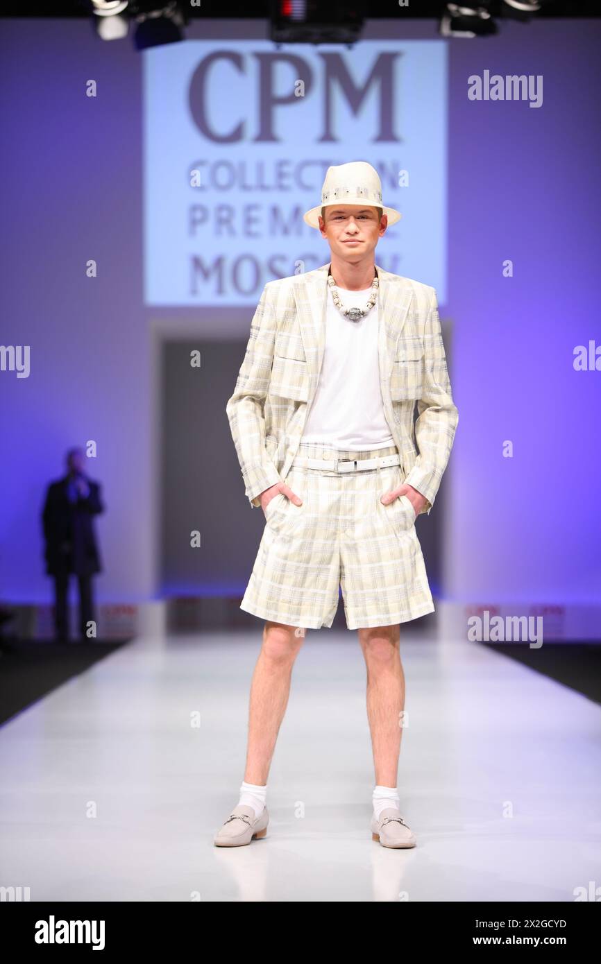 MOSCOW - FEBRUARY 22: Man wear white suit from Slava Zaytzev walk the ...