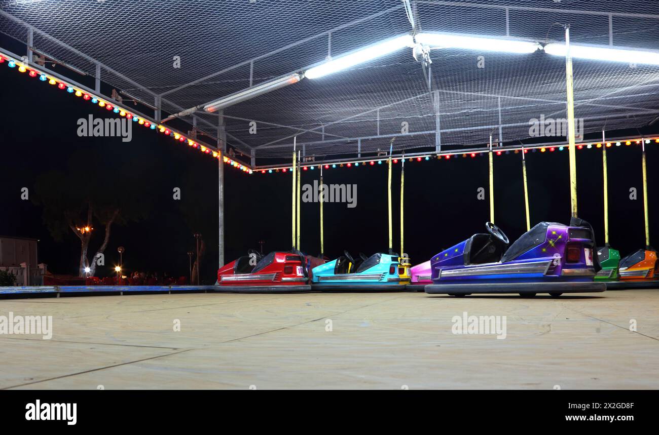 Amusement Car Ride. Several colorful, bright cars. dark night Stock ...