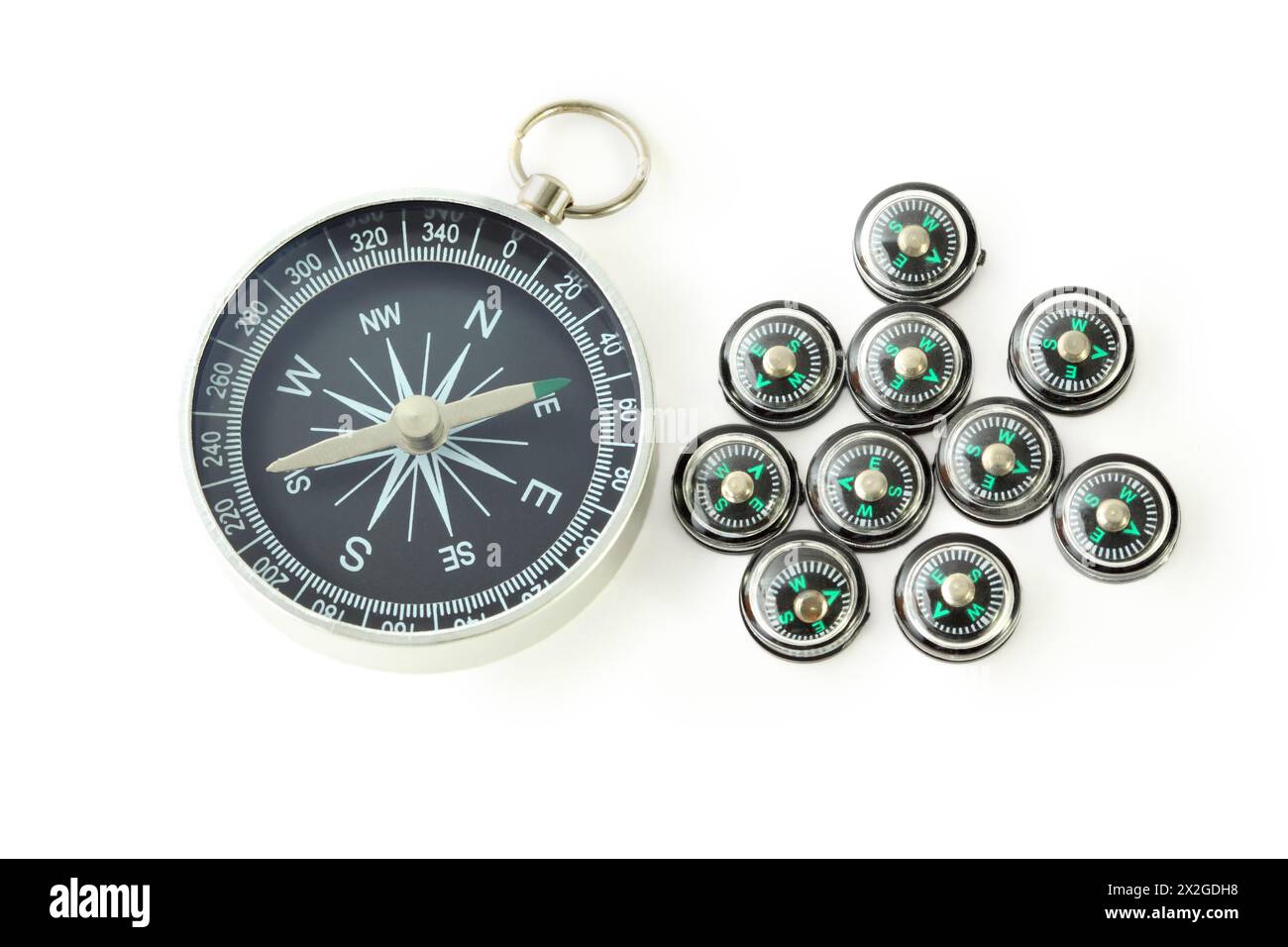 big compass with ten black small compasses isolated on white Stock ...