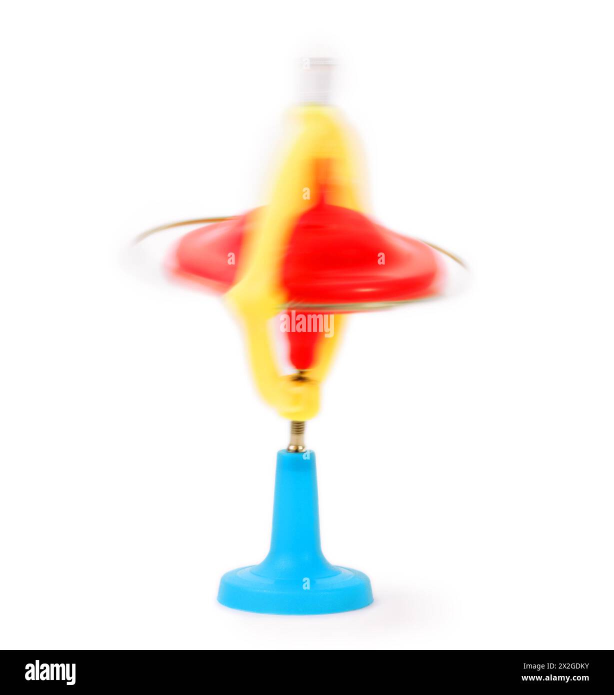 spinning red, blue and yellow whirligig, children toy isolated on white ...