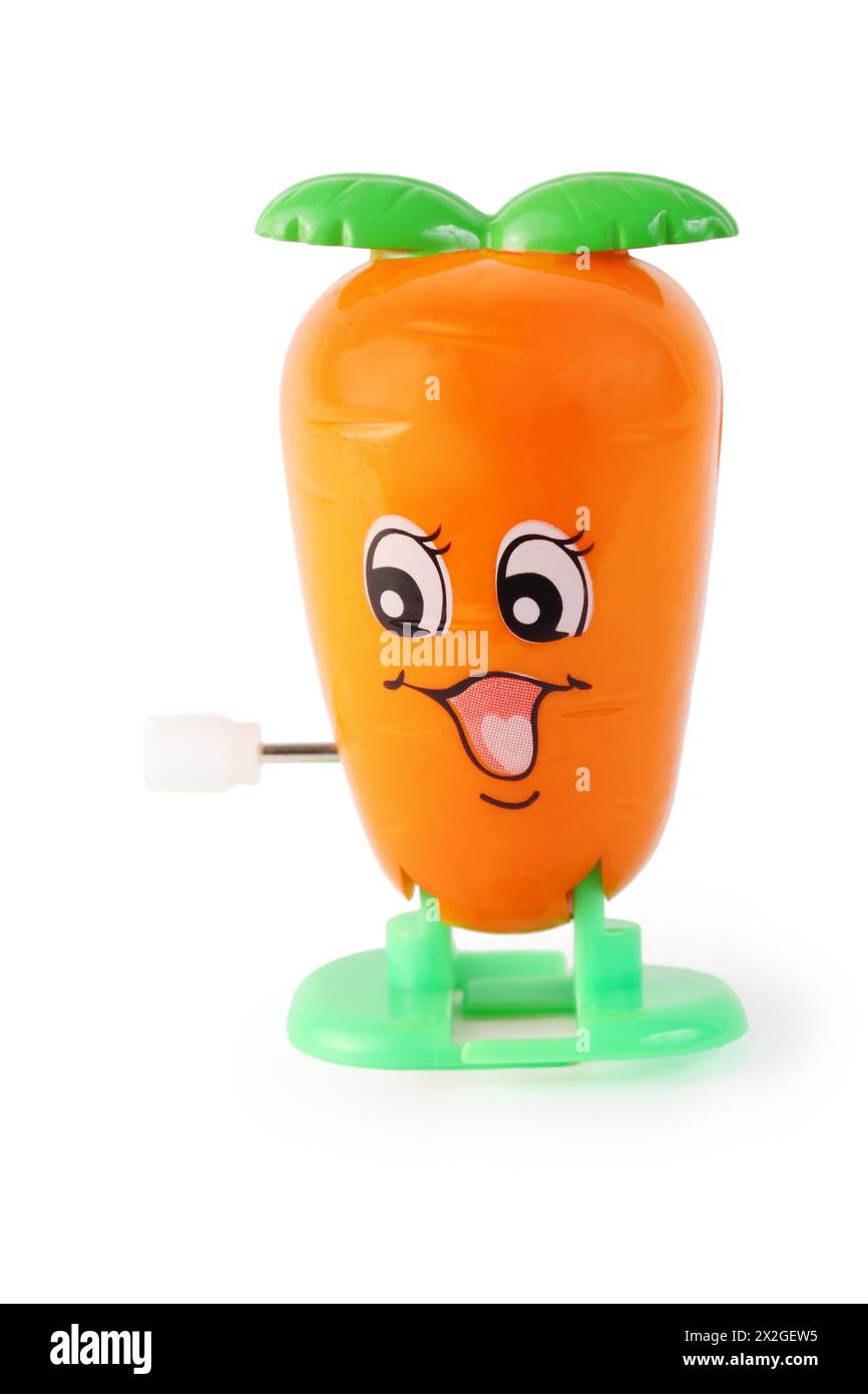 funny toy clockwork orange carrot with face on white background Stock ...
