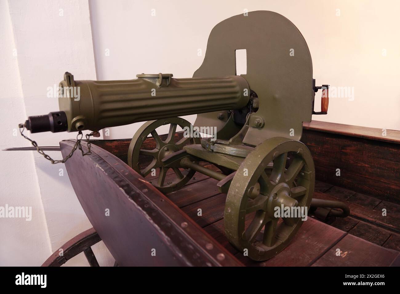 old Soviet green gun stands on wooden cart; weapons since World War II ...