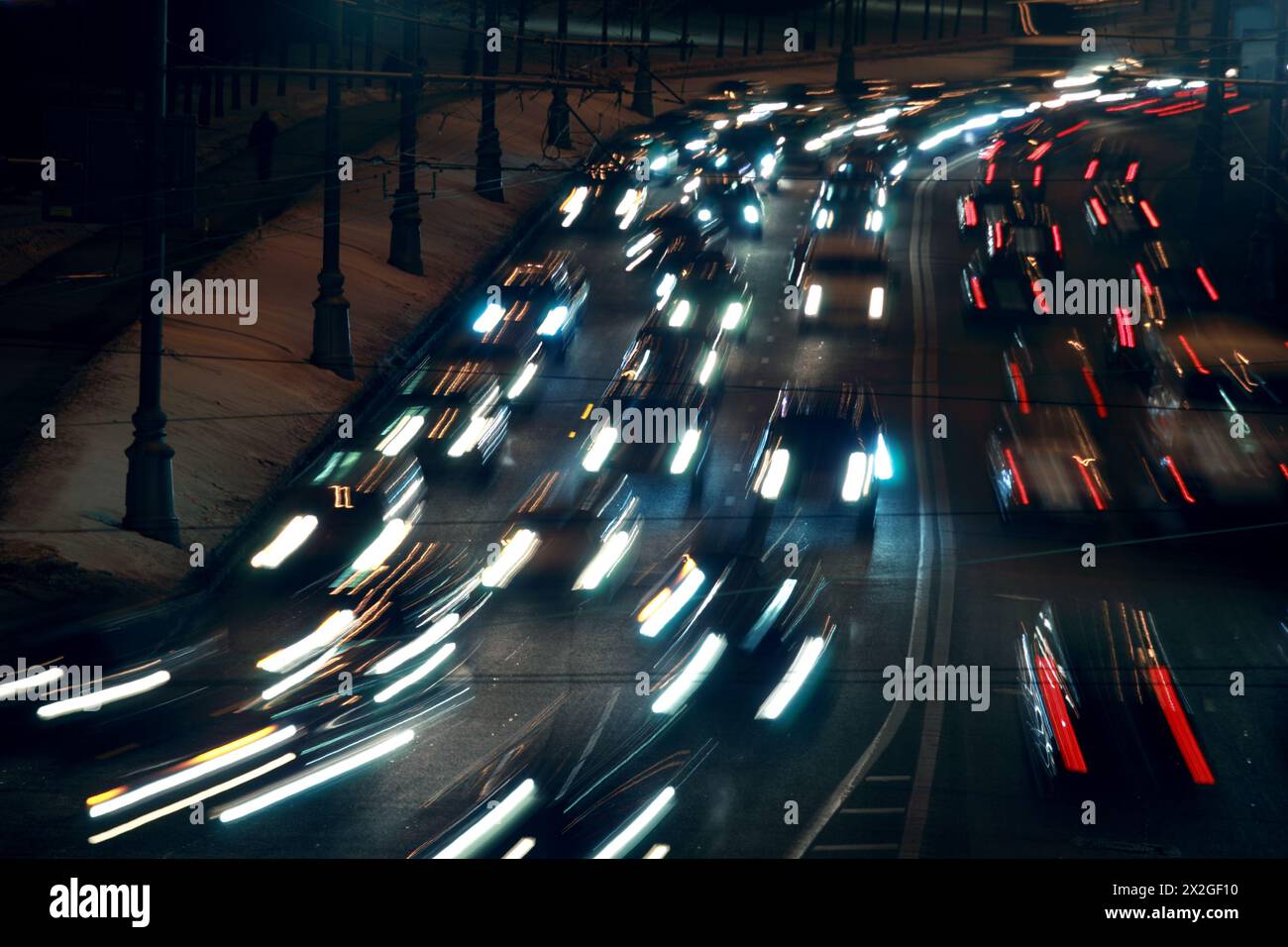moving traffic at night with moving lights at winter; many cars Stock ...
