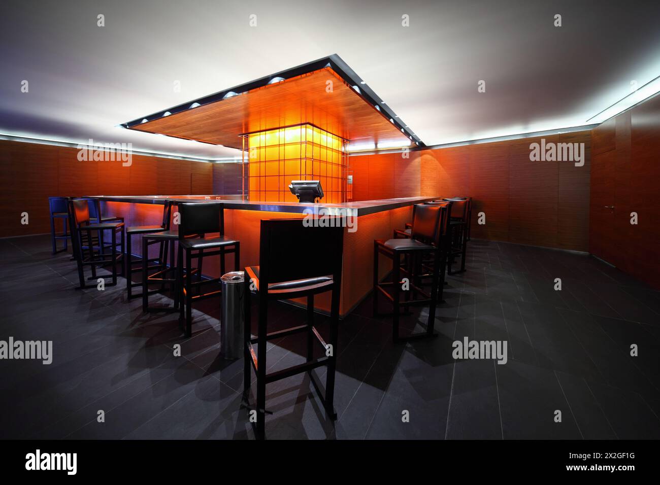 Square pale in bar and dinner-wagons round Stock Photo - Alamy