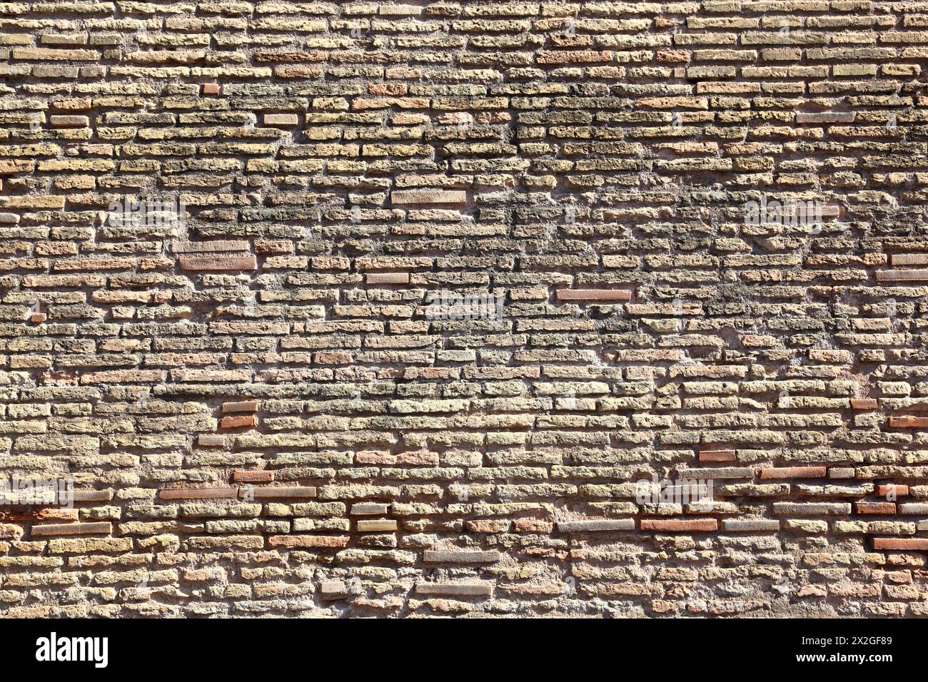 old, bright, yellow brick Vatican walls. flat horizontal laying Stock ...
